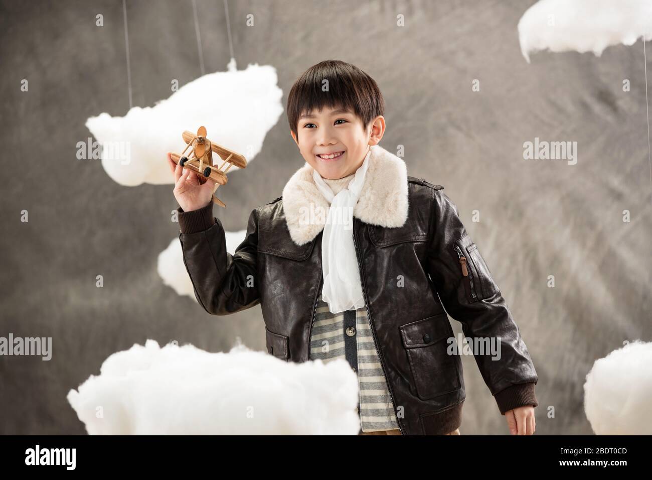 Happy boy with a toy plane Stock Photo - Alamy