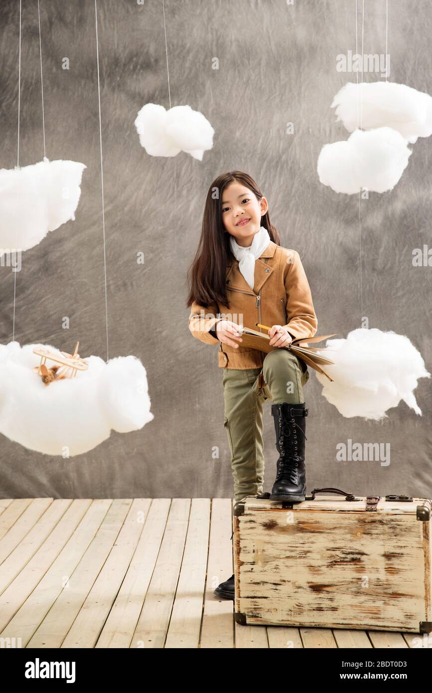 Write diary flight happy girl Stock Photo - Alamy