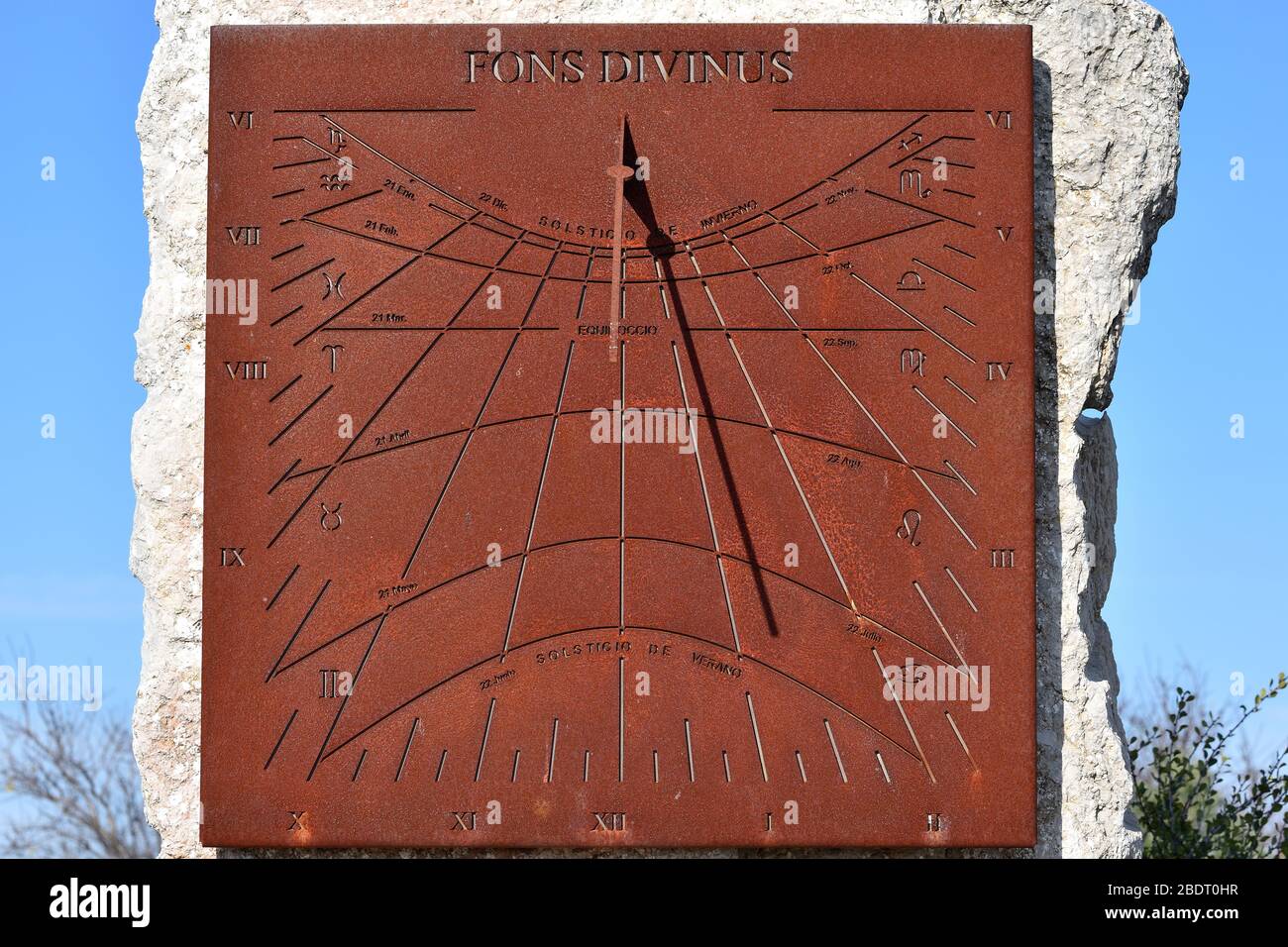 Square brown metal sundial that marks the astrological time, seasons ...