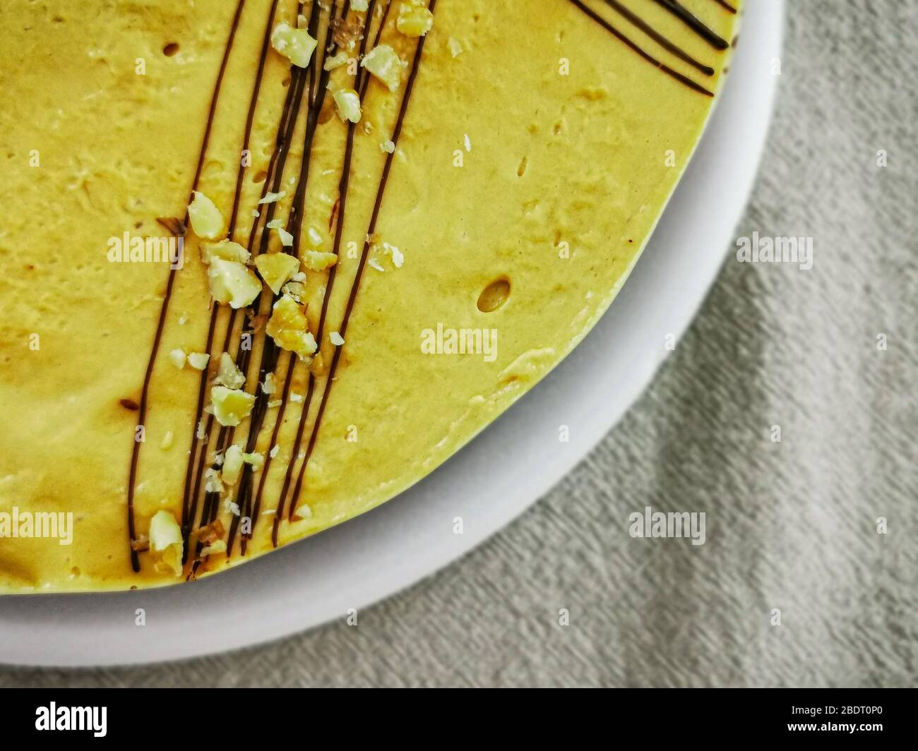 Caramel cake with powdered sugar on top, close up shot Stock Photo - Alamy