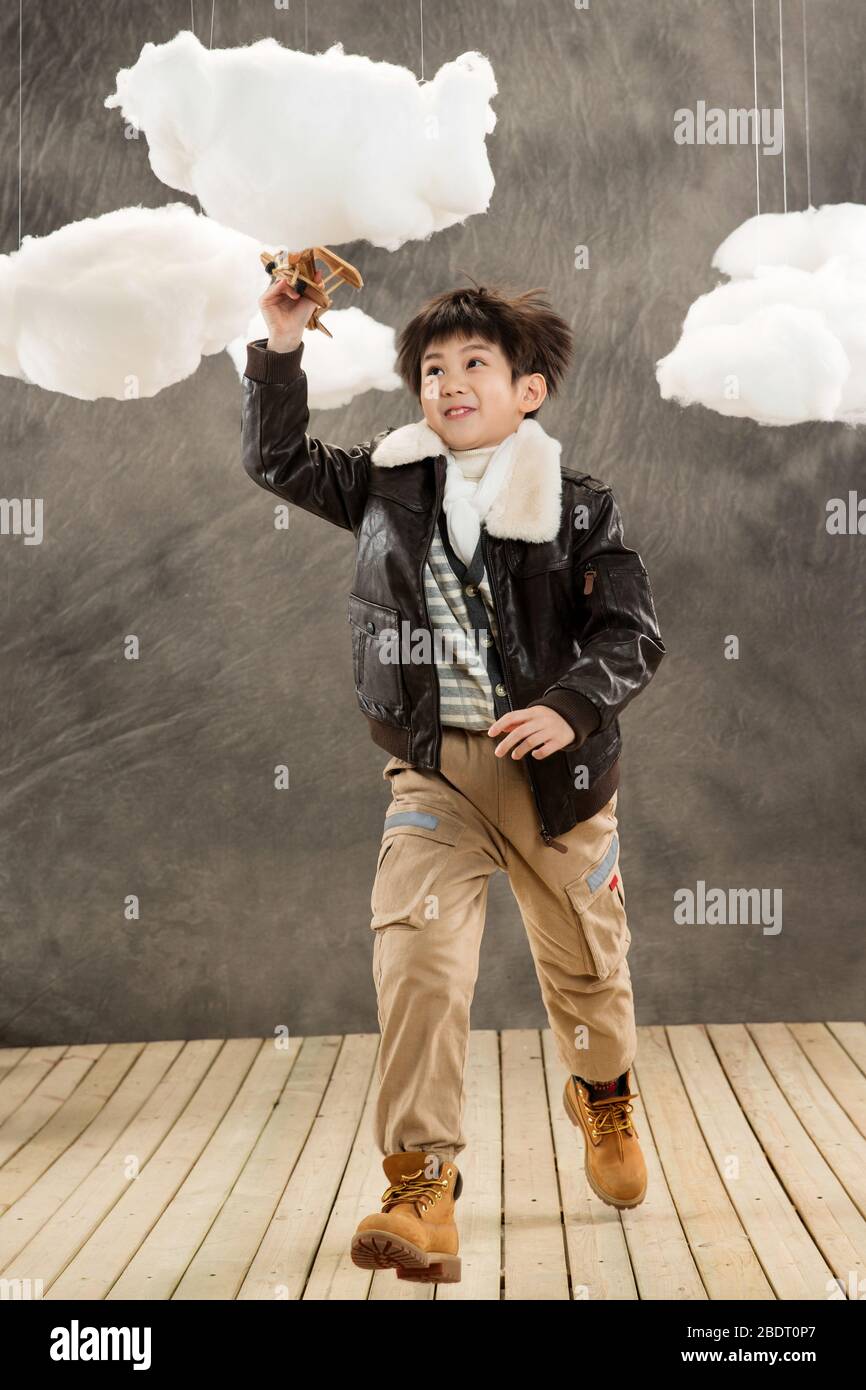 With a model plane running boy Stock Photo - Alamy