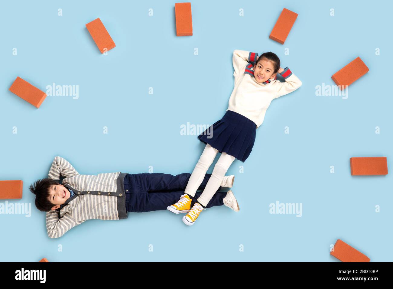 Happy children's play creative alarm clock Stock Photo - Alamy