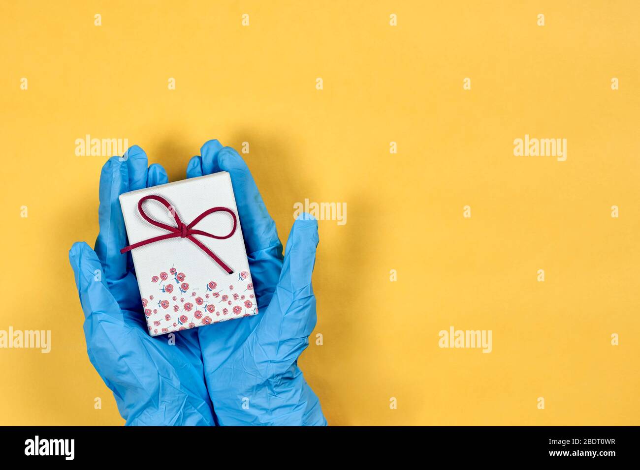 Celebration holiday, birthday in hospital. Doctor giving giftbox to ...