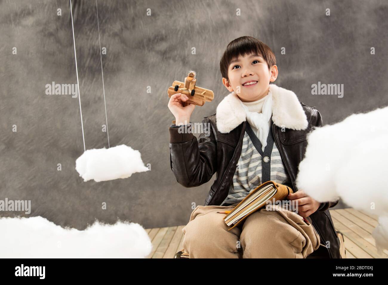 Happy boy with a toy plane Stock Photo - Alamy