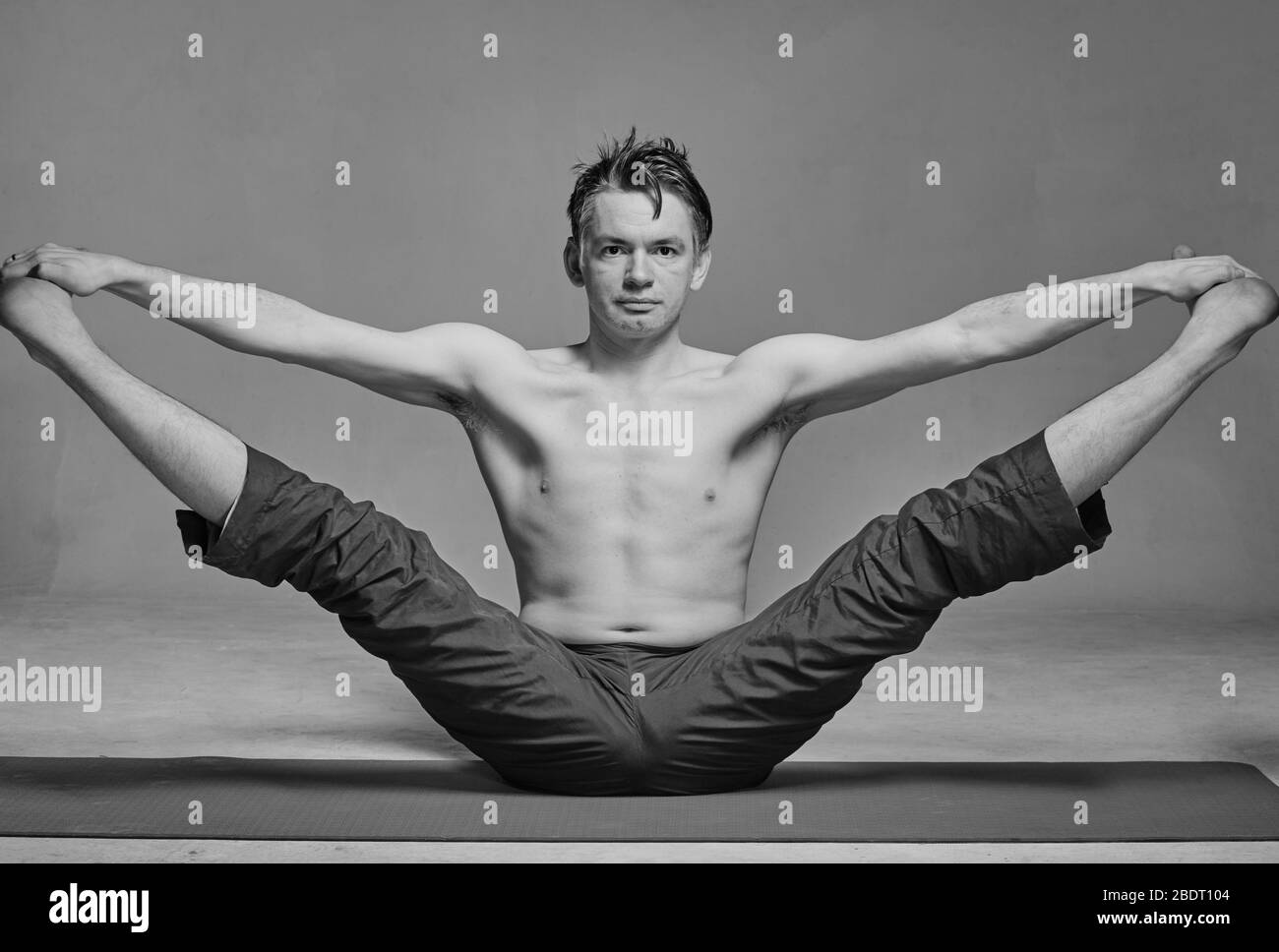 Man performing yoga hi-res stock photography and images - Alamy