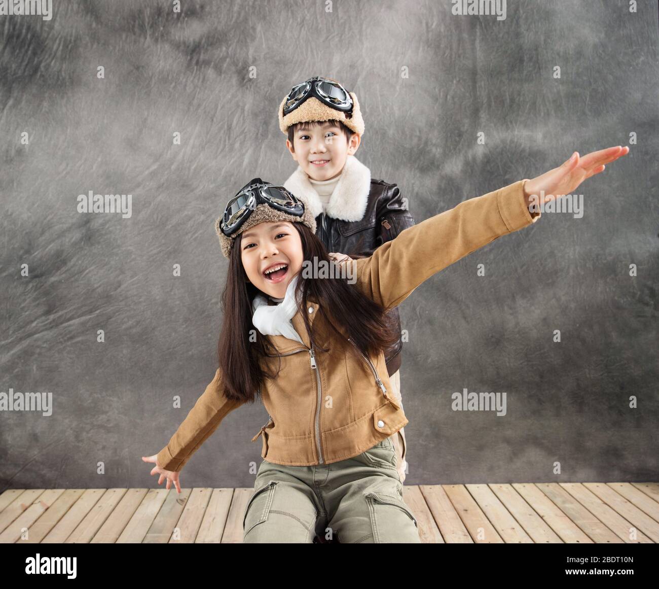 Happy little pilots play together Stock Photo - Alamy