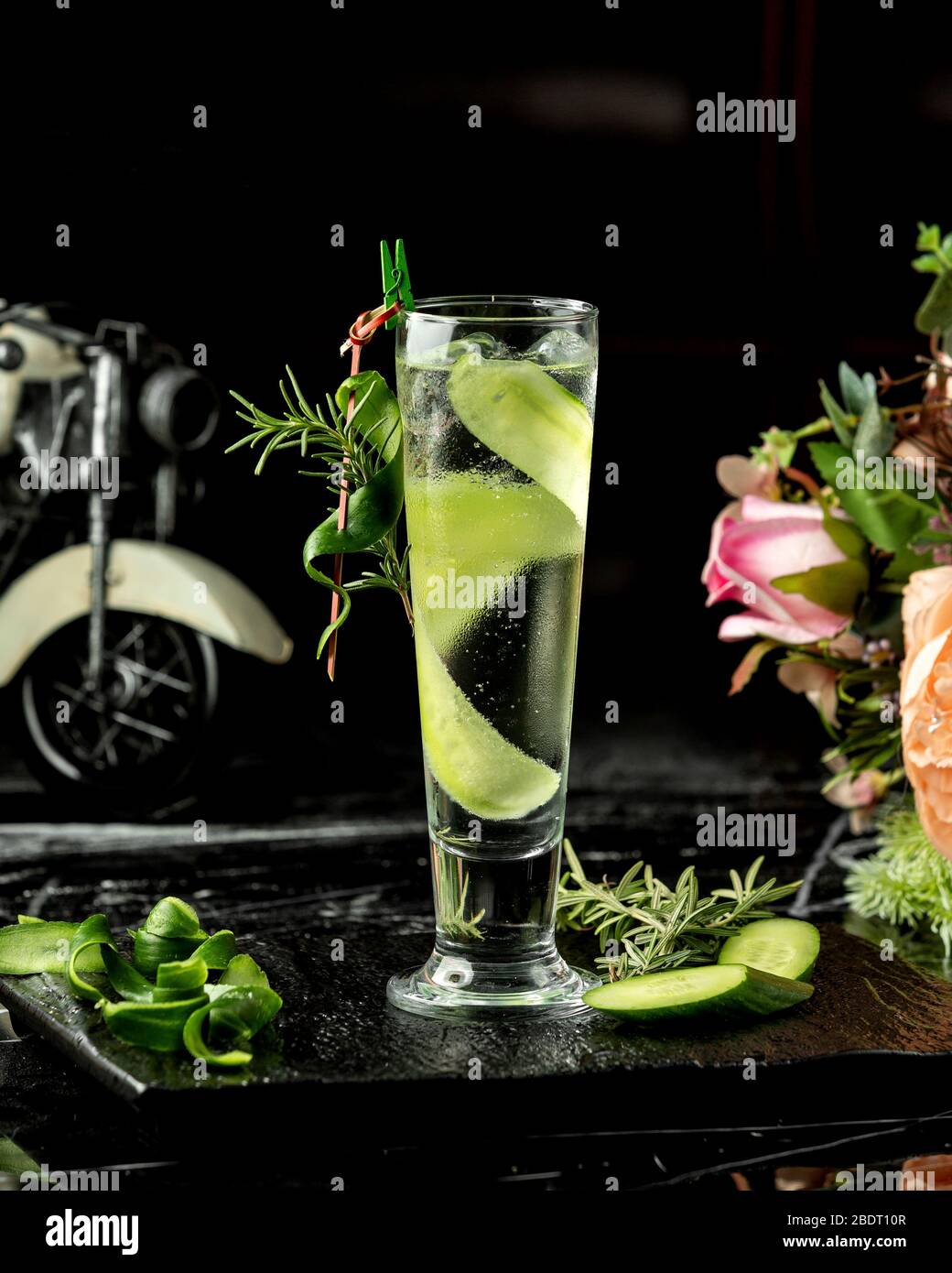 a glass of cold cucumber water garnished with cucumber slice Stock ...