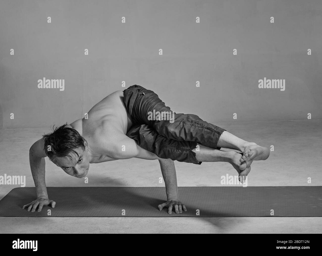 Man performing yoga hi-res stock photography and images - Alamy