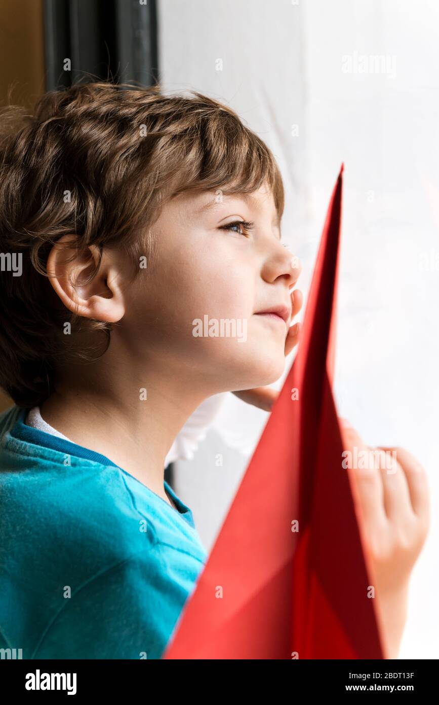 Child looking through the window hi-res stock photography and images ...