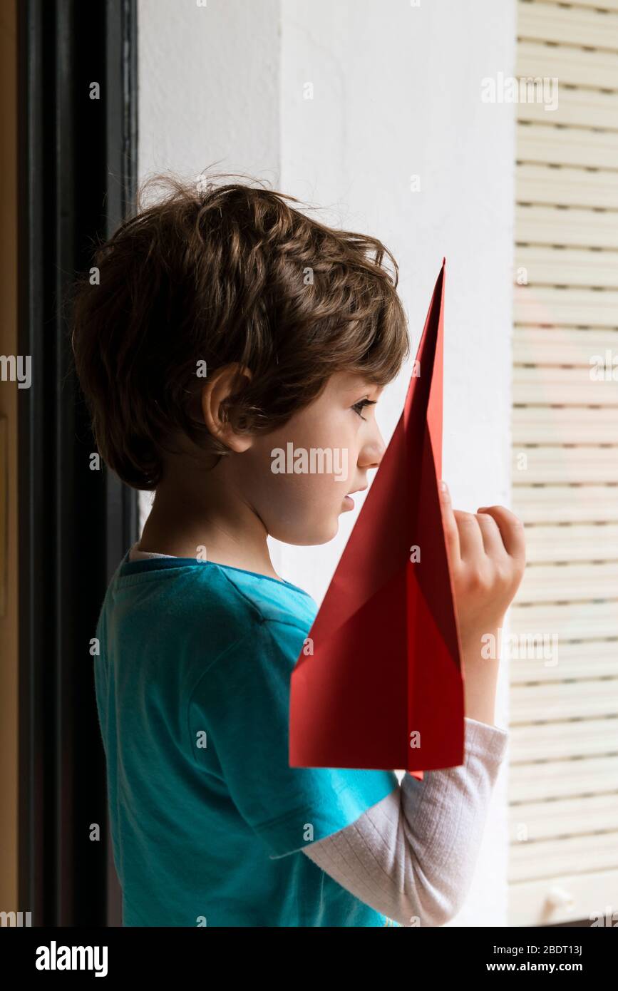 Child looking through the window hi-res stock photography and images ...