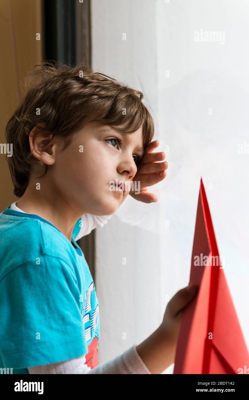 Child looking through the window hi-res stock photography and images ...