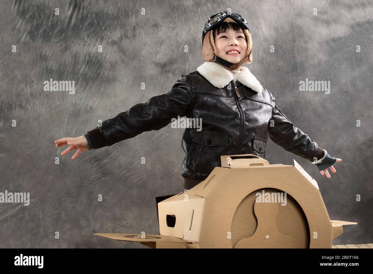 Happy children's driving paper airplanes Stock Photo - Alamy