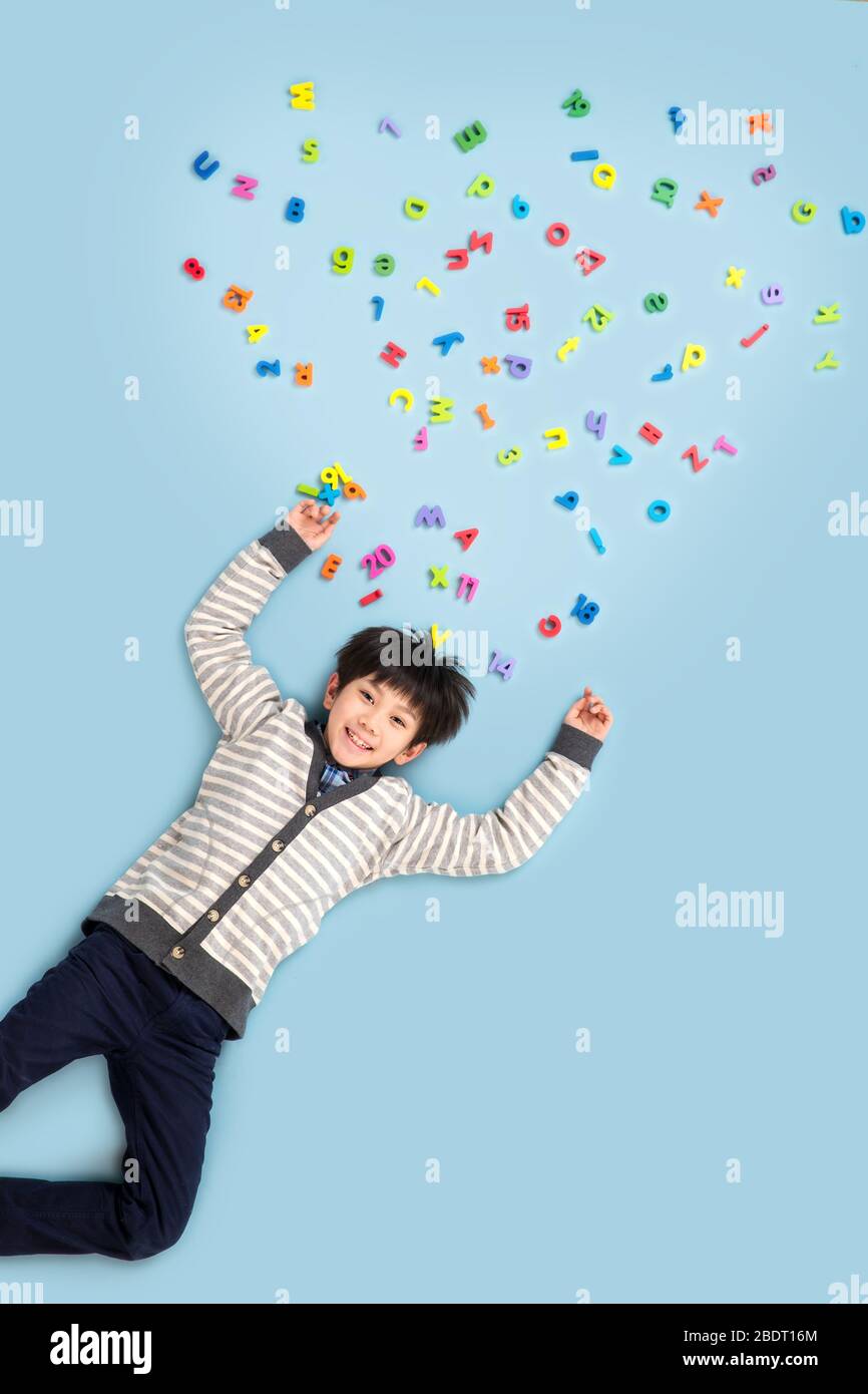 Happy learning boy letters and Numbers Stock Photo - Alamy