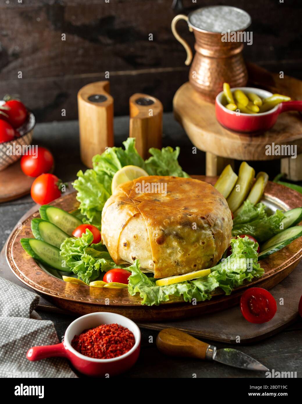 a platter with azerbaijani rice dish shah pilaf cooked in flatbread ...