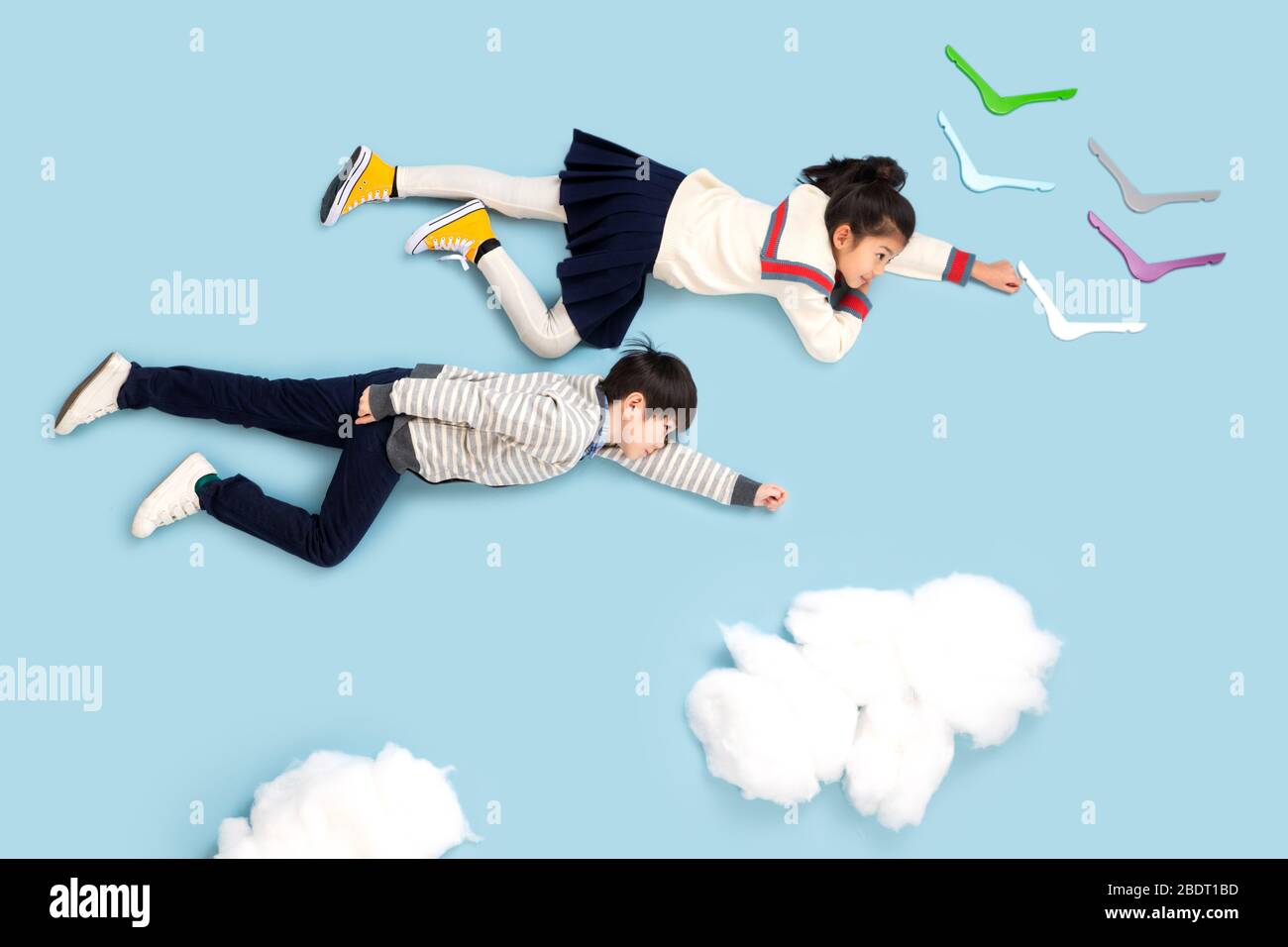 Happy children's simulation fly in the sky Stock Photo - Alamy