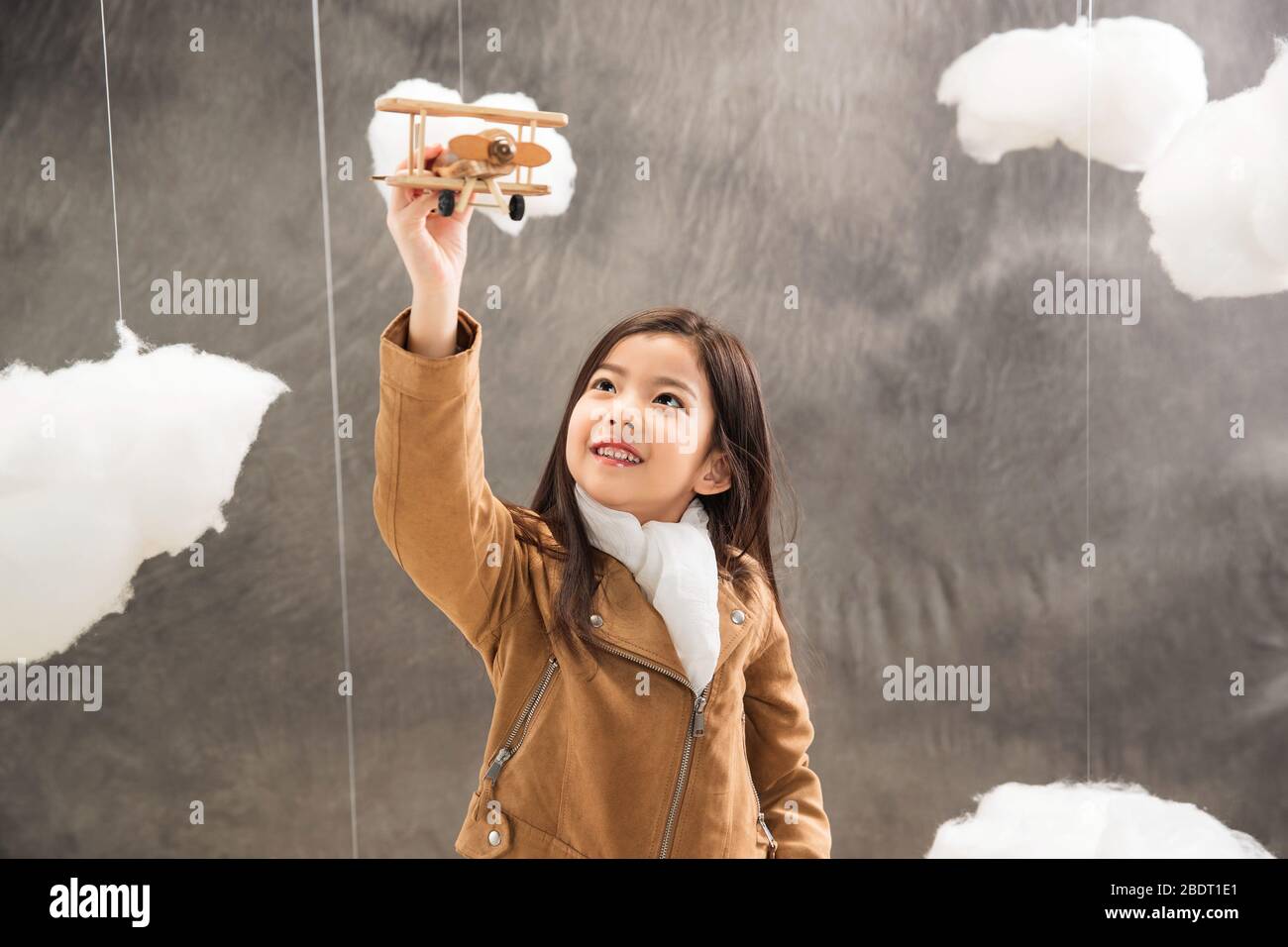 Happy girl with a model plane Stock Photo - Alamy