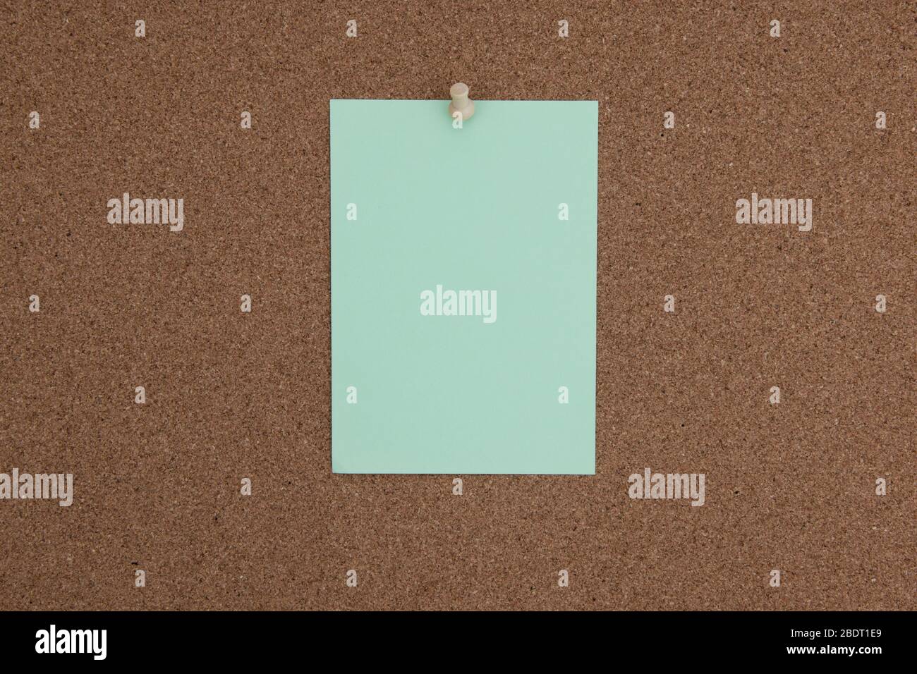 Cork board with tacks and green flash card Stock Photo - Alamy