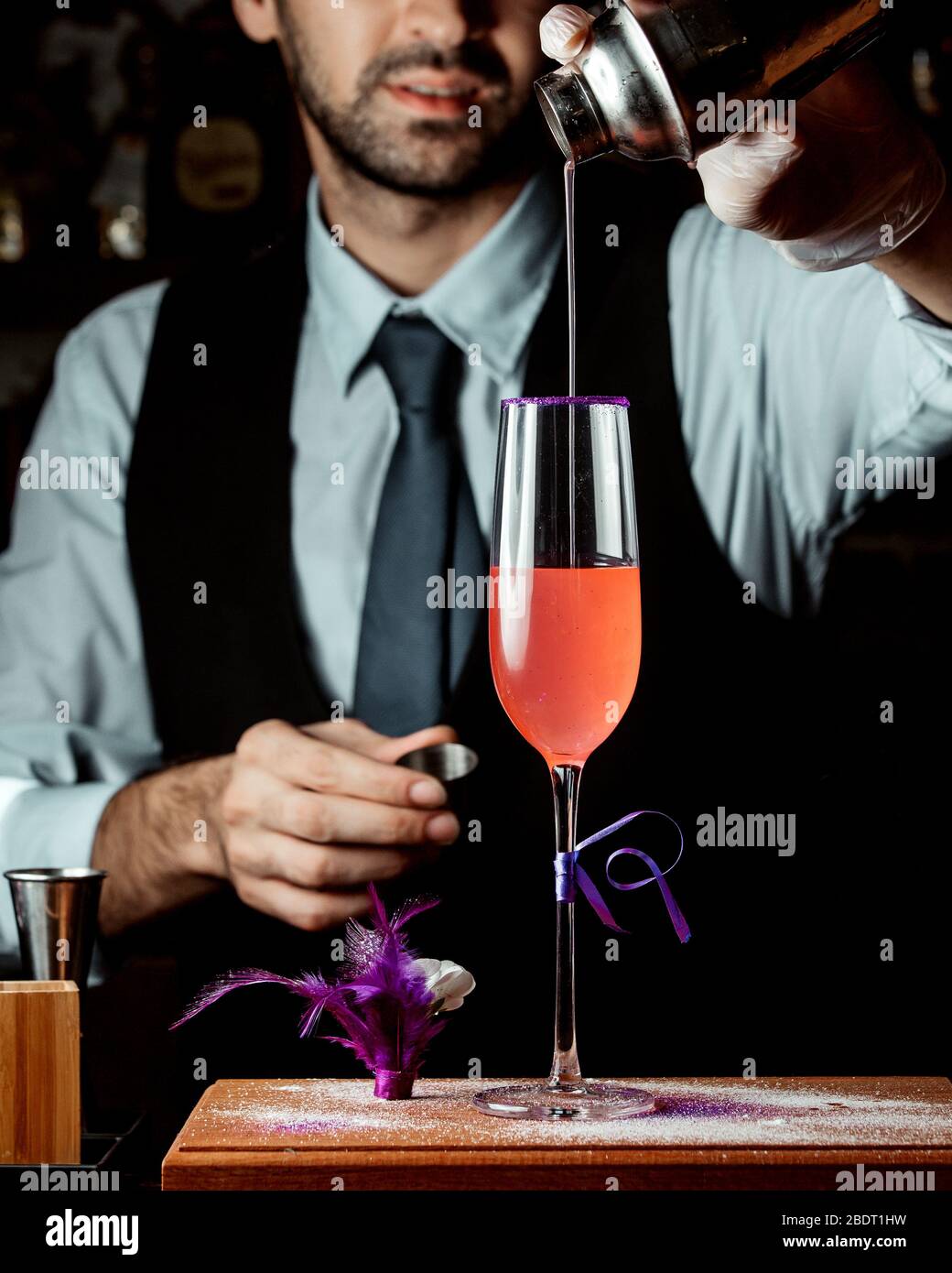 Bartender pours glass from shaker hi-res stock photography and images ...