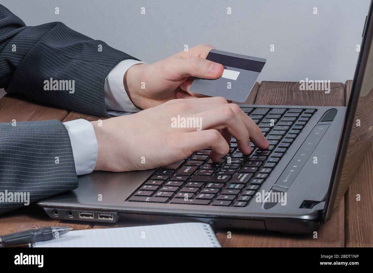 Businessman makes online purchases using hi-res stock photography and ...