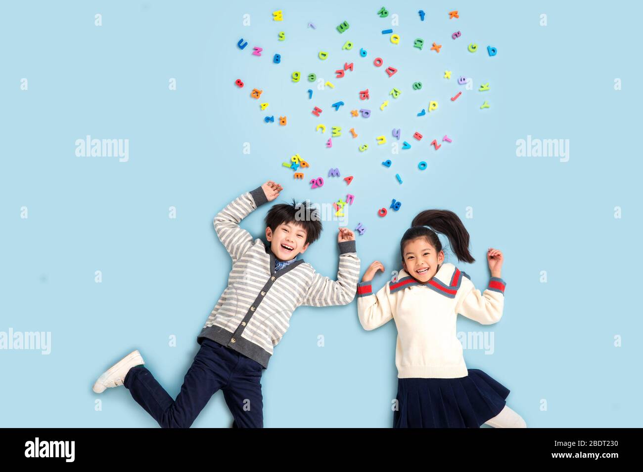 Happy children learn alphanumeric character Stock Photo - Alamy