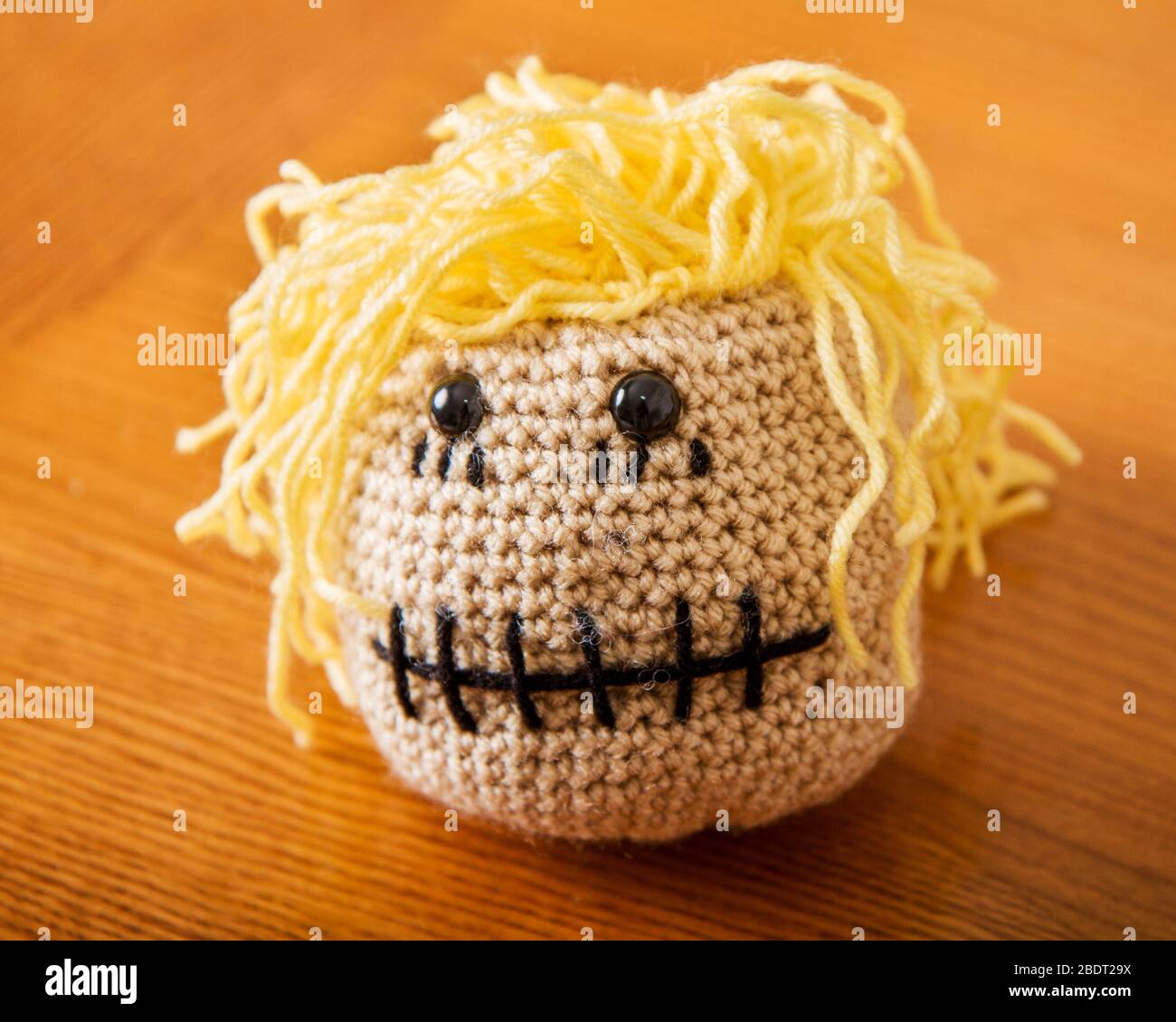 weird creepy handmall doll head from yarn Stock Photo - Alamy
