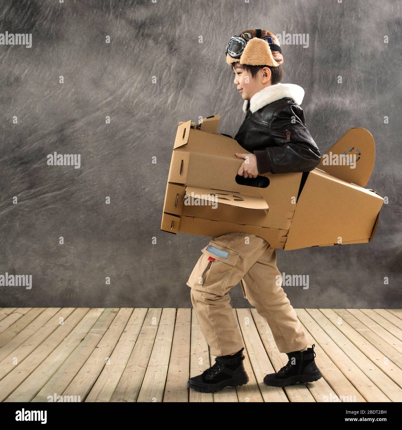 Happy children's driving paper airplanes Stock Photo - Alamy