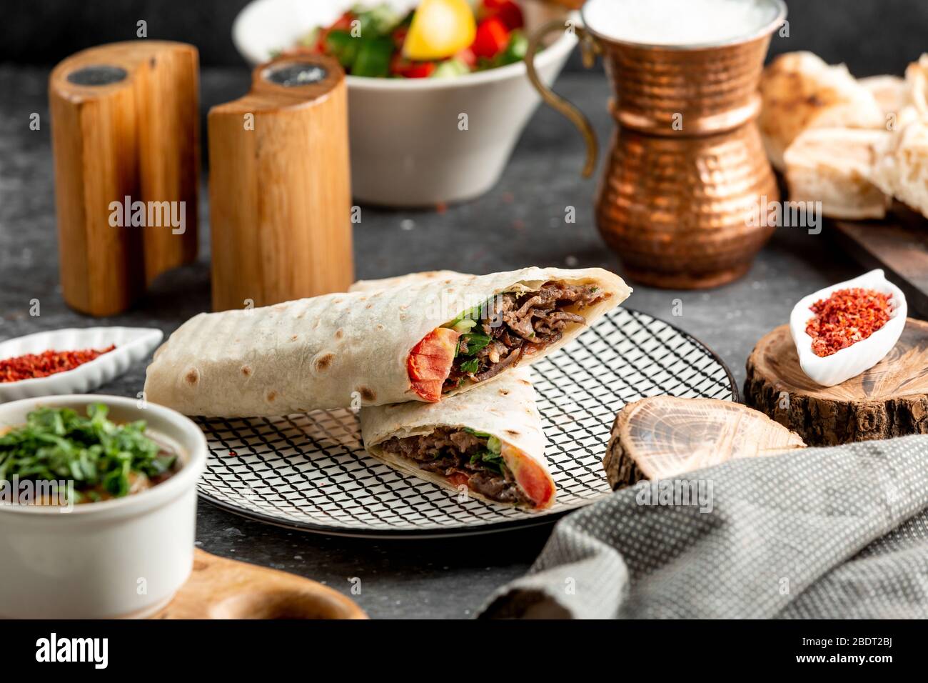 half-cut beef doner in flatbread wrap Stock Photo - Alamy