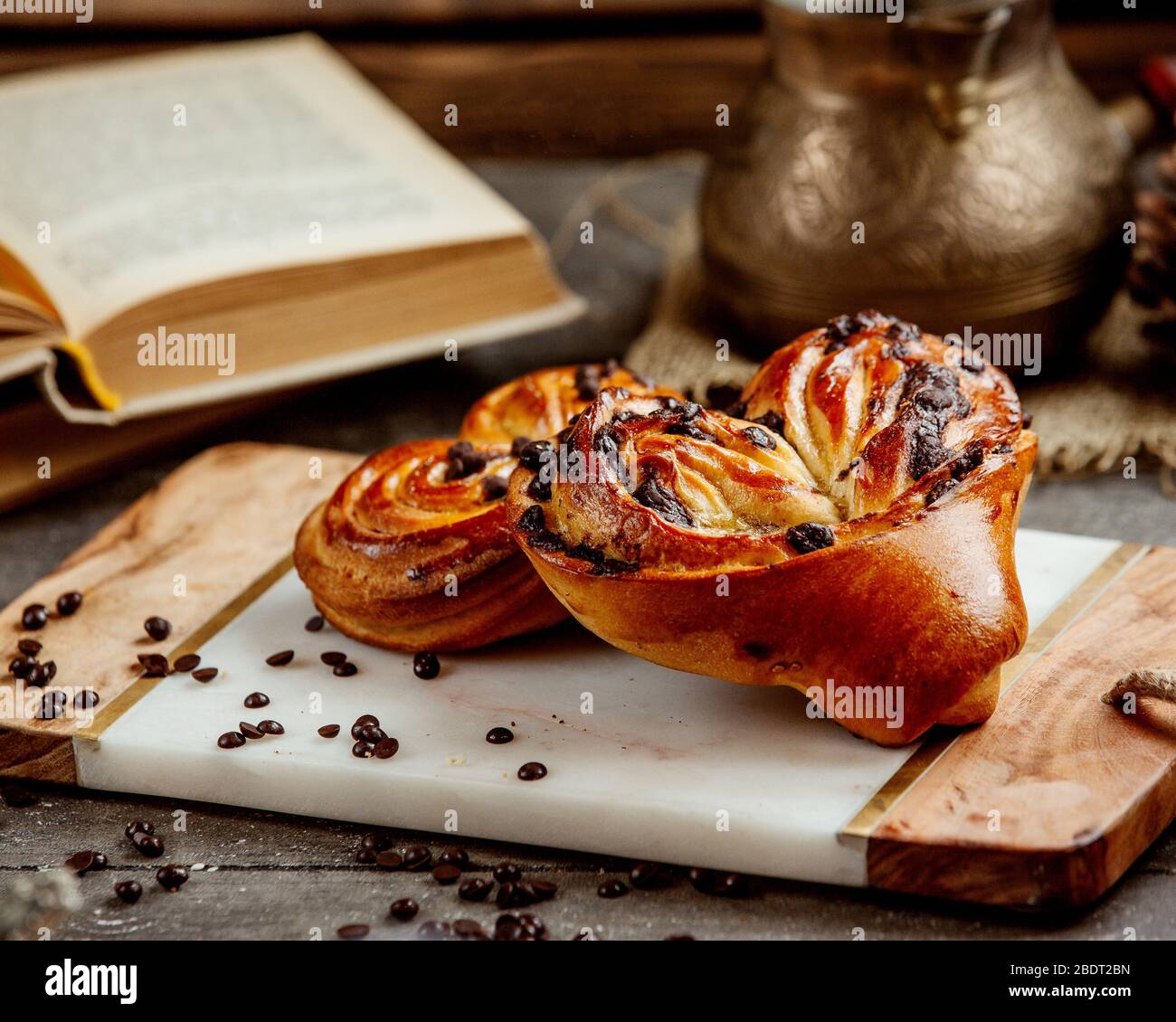 heart-shaped sweet buns with chocolate pieces Stock Photo - Alamy