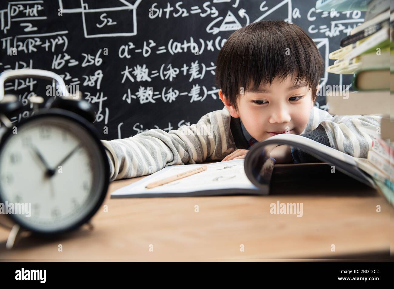 Happy learning of primary school boy Stock Photo - Alamy