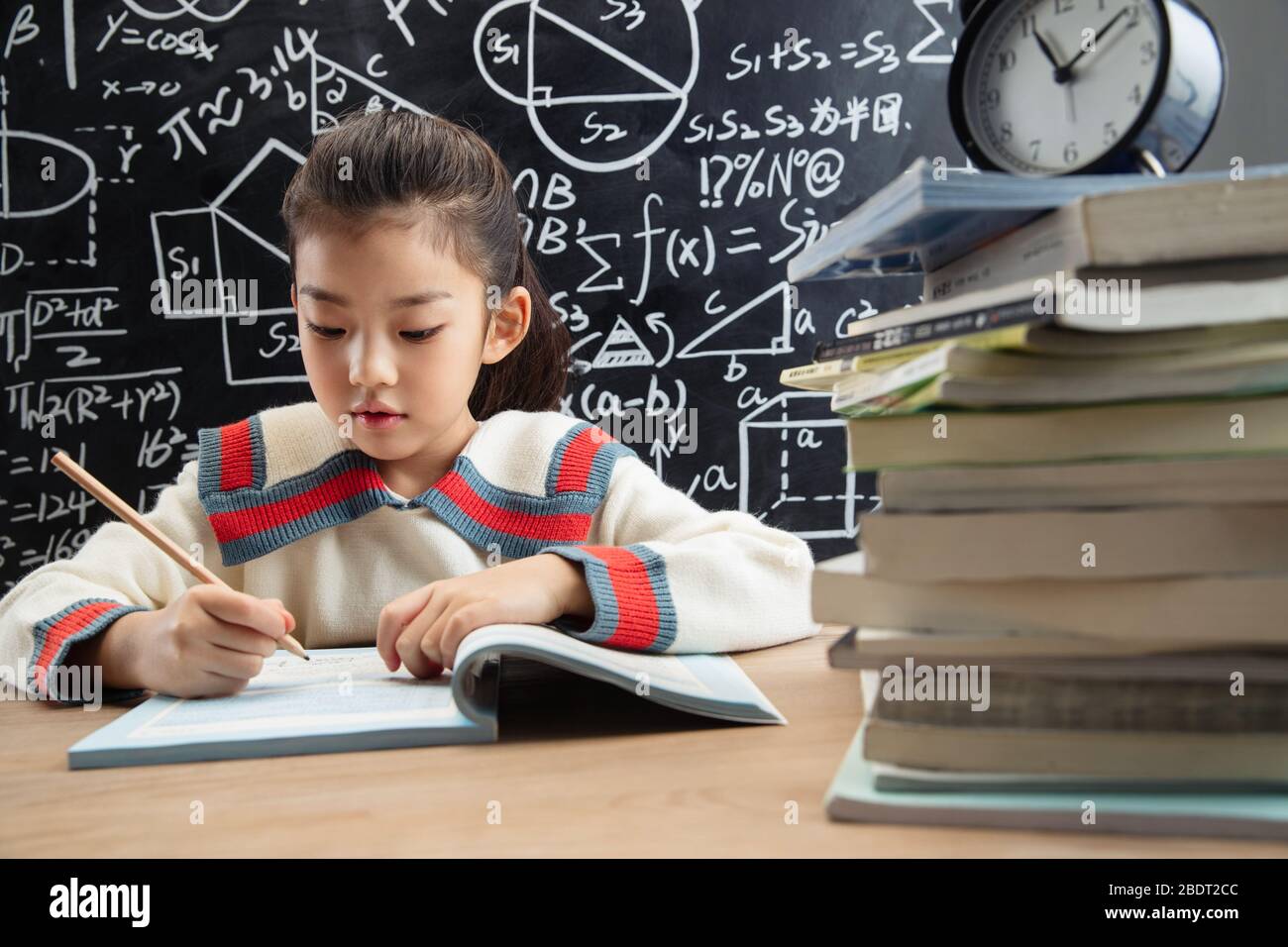 Elementary school students homework seriously Stock Photo - Alamy