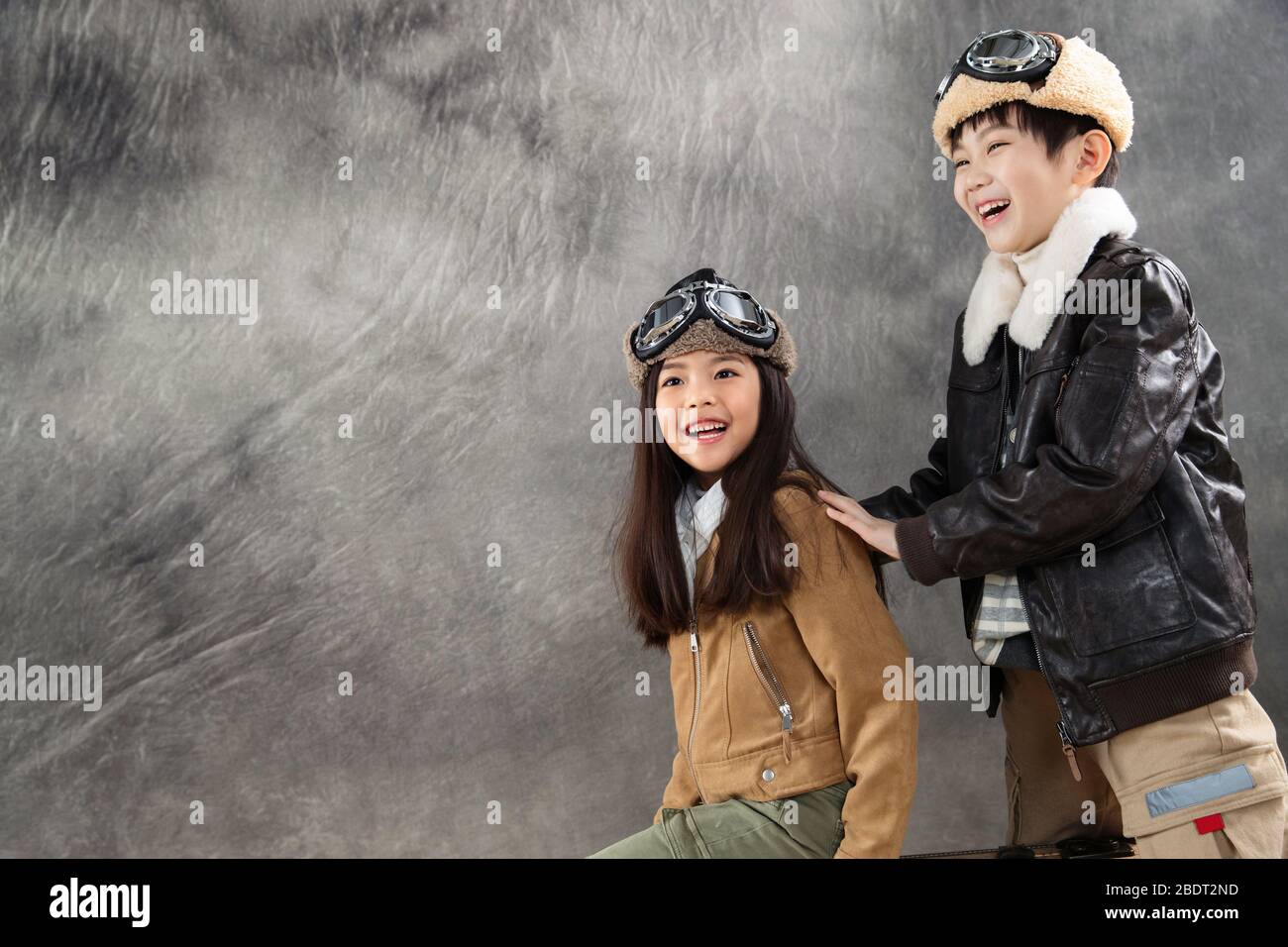Two happy little pilots play together Stock Photo - Alamy
