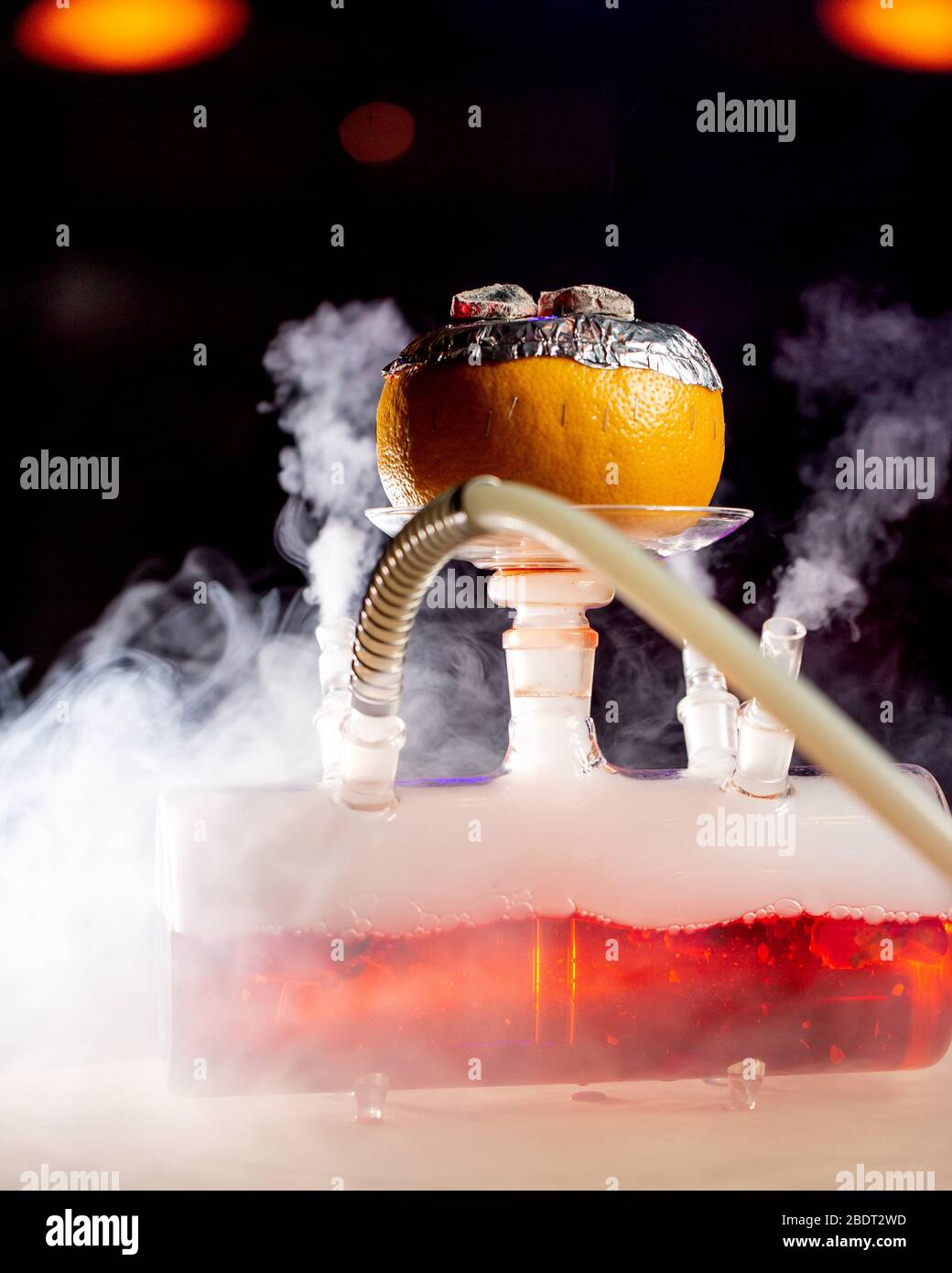 smoke coming out from grapefruit hookah glass base Stock Photo - Alamy