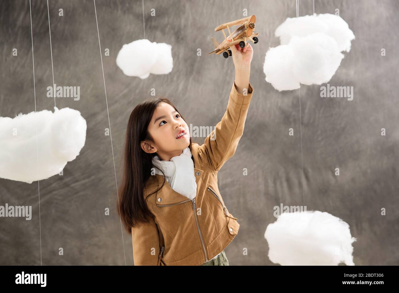 Happy girl with a model plane Stock Photo - Alamy