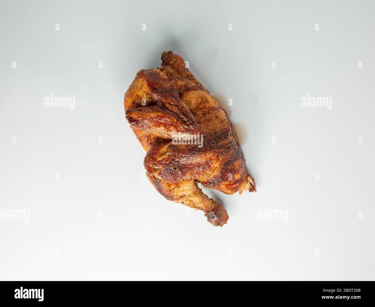 top side view of whole grilled chicken in white background Stock Photo ...