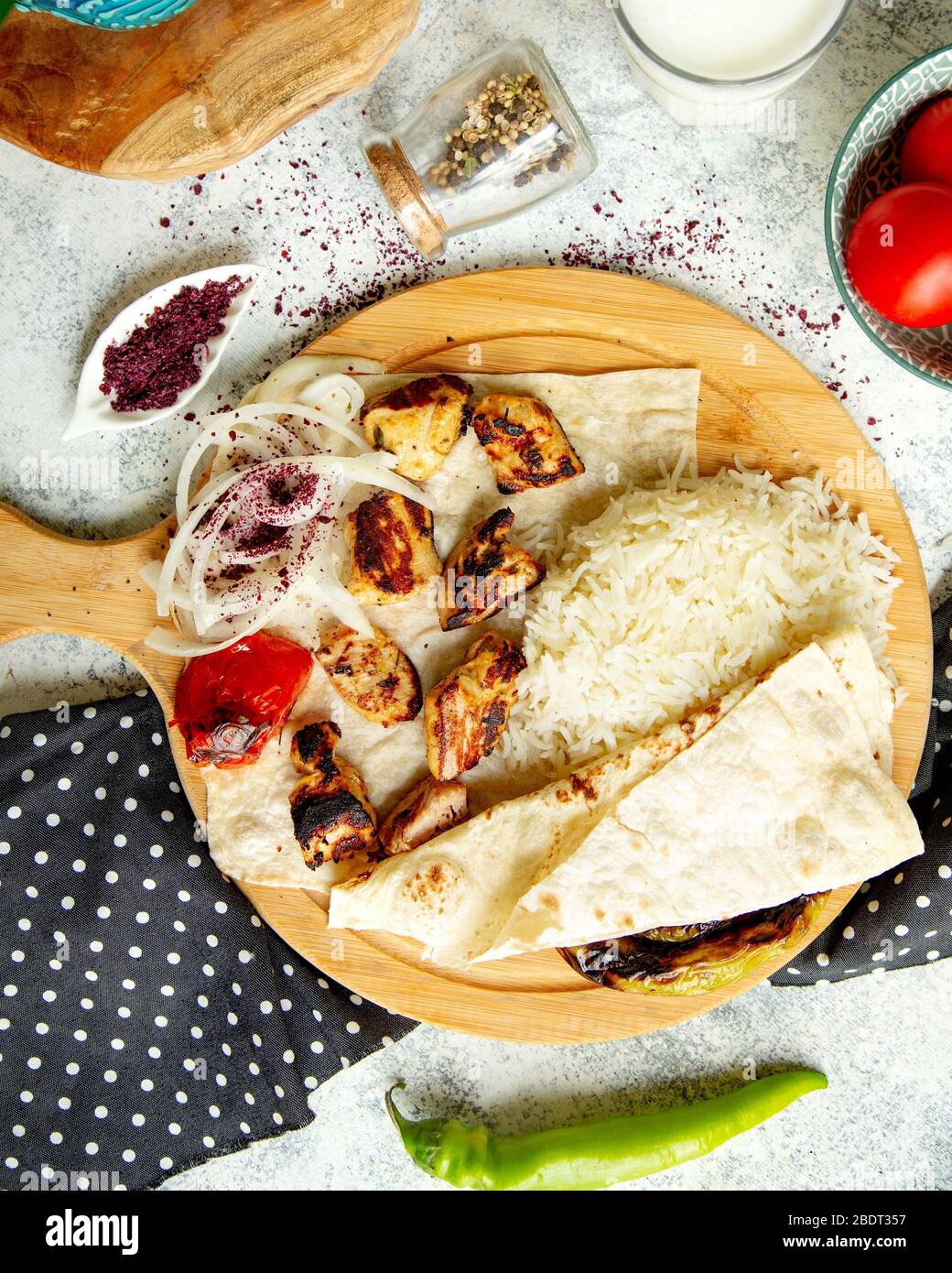top view of chicken kebab served with rice flatbread onion and sumac ...