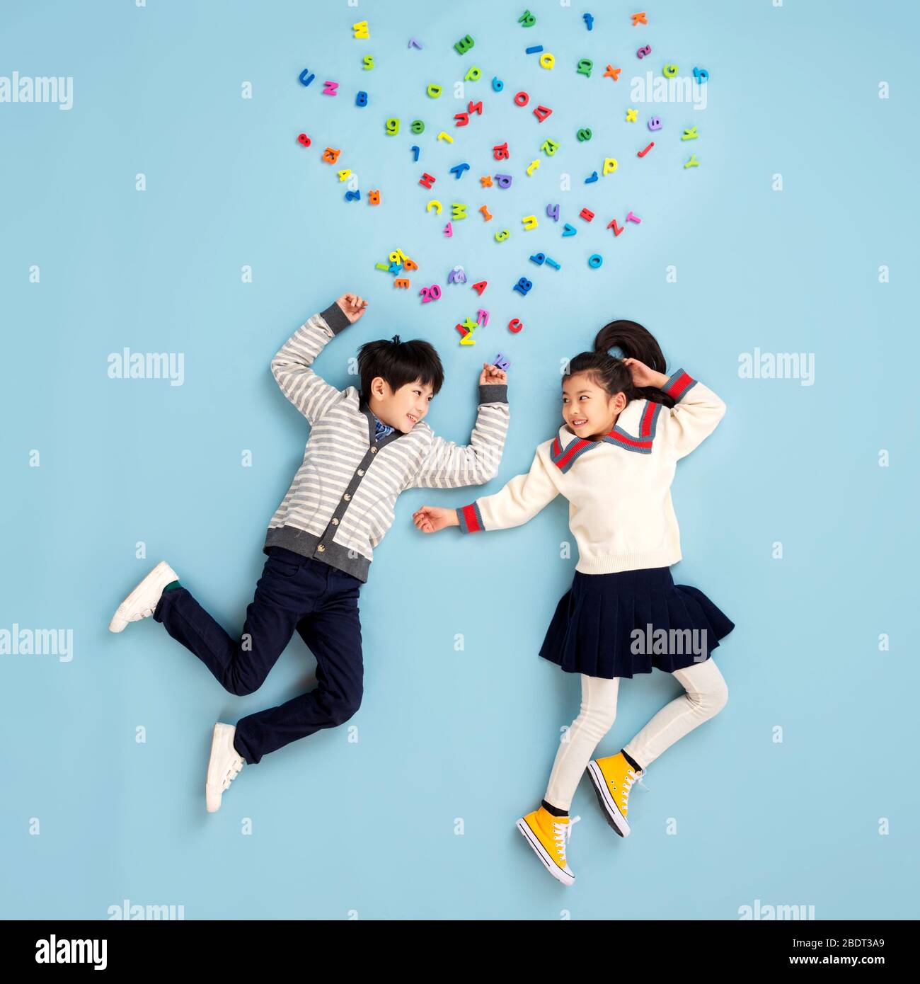 Happy children learn alphanumeric character Stock Photo - Alamy