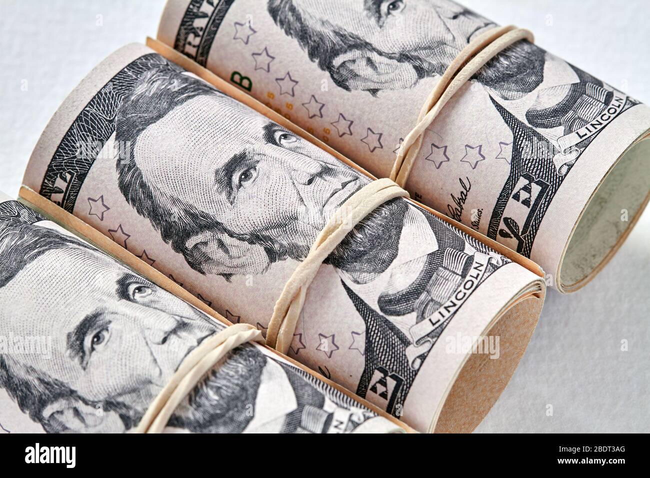 American twenty dollar banknotes rolled up as a tubule. Light ...