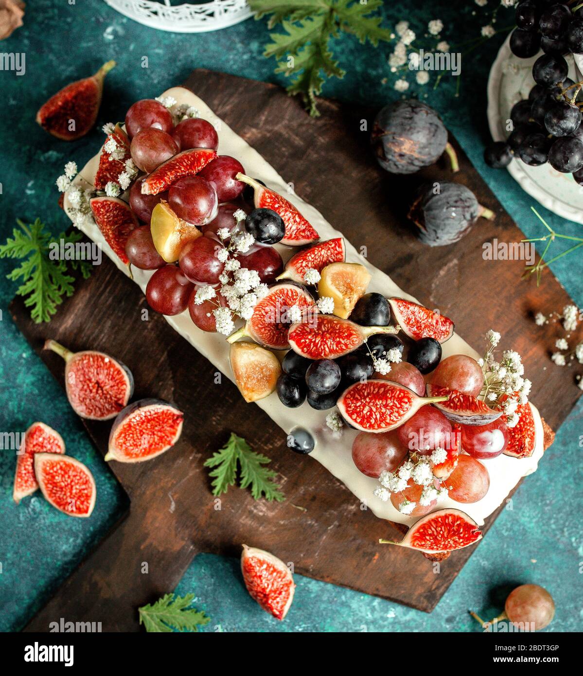 top view of long pie decorated with pigs and grapes Stock Photo - Alamy