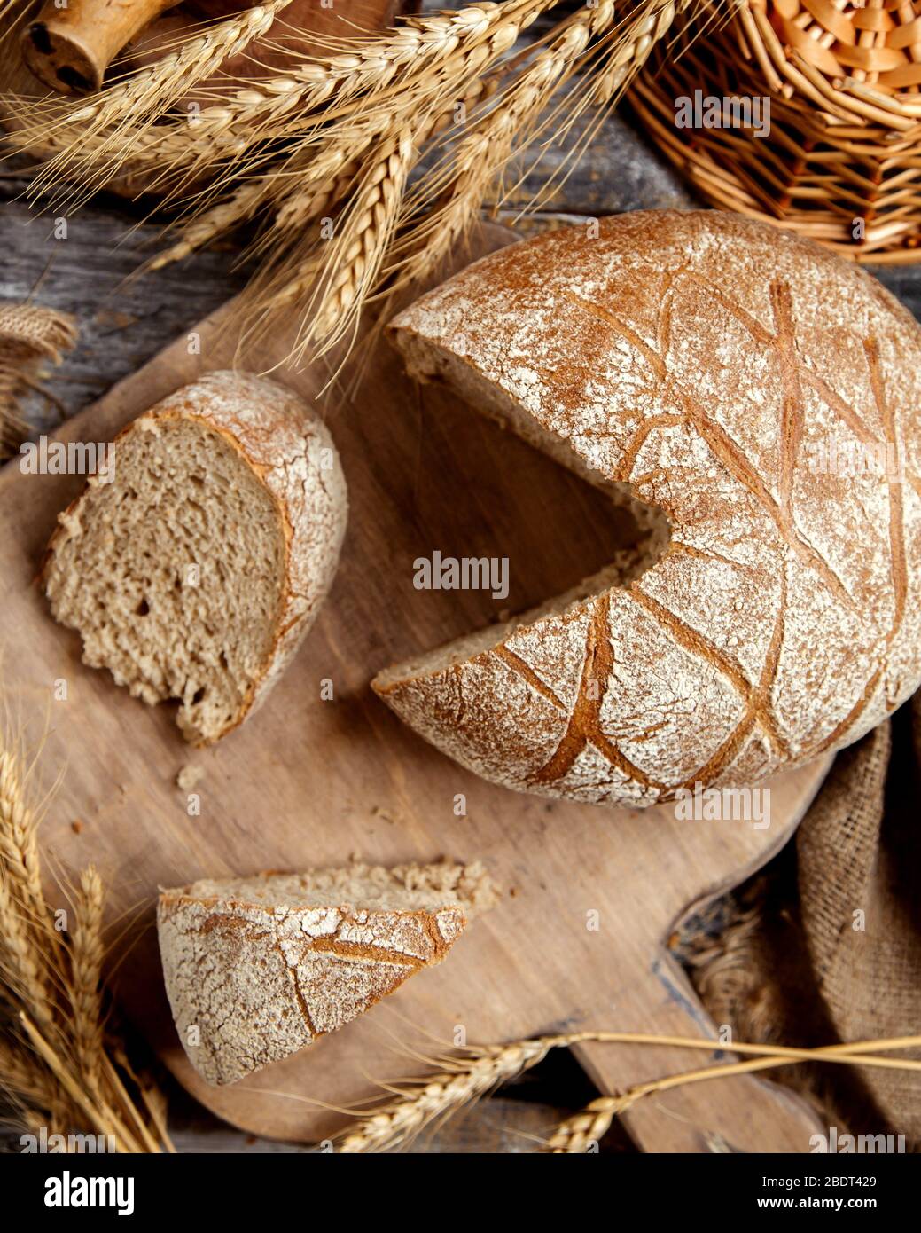 top view of whole grain bread and its slices served in rustic style ...