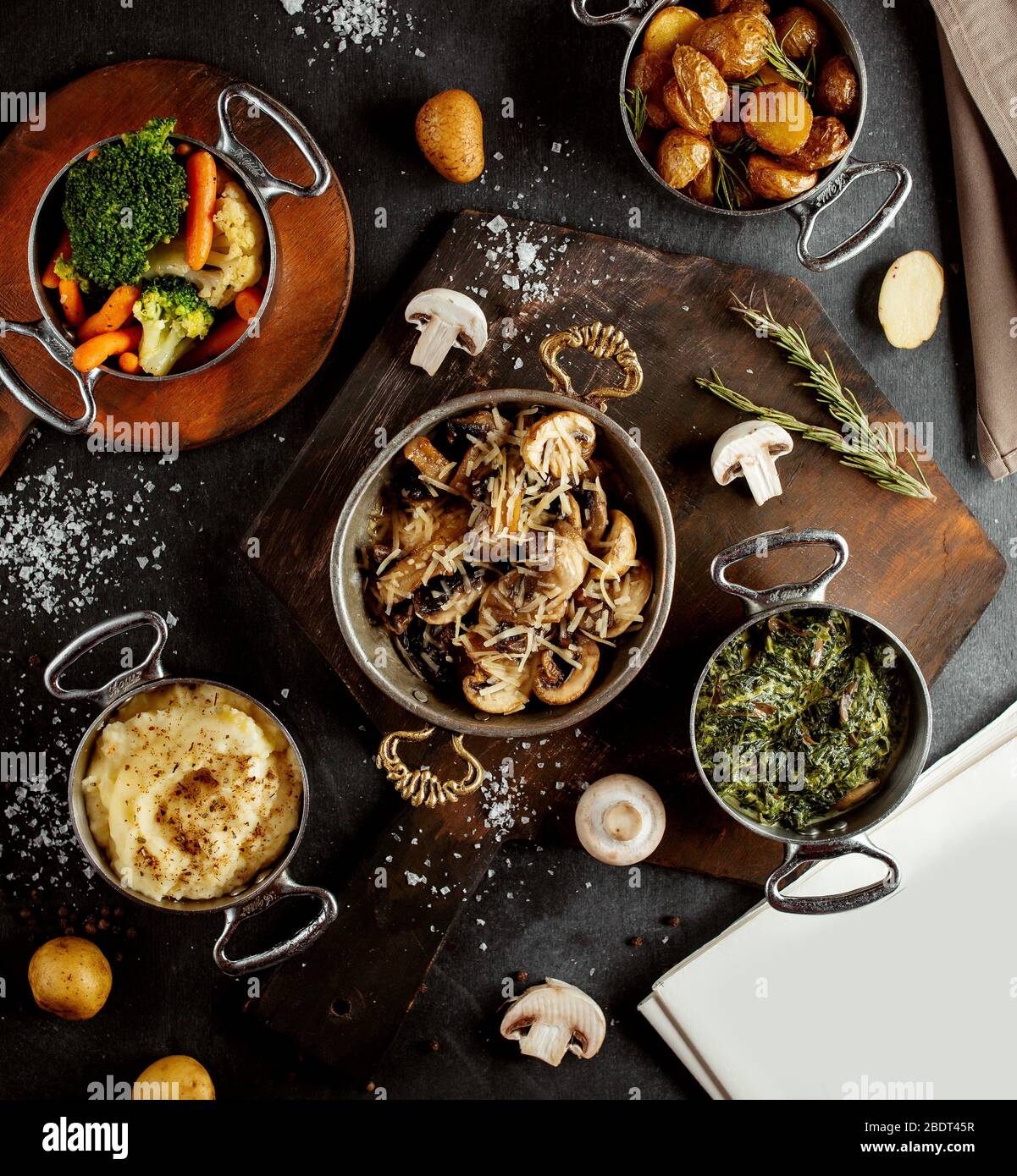 top view of pans with mushroom sautee mashed potato sabzi boiled ...