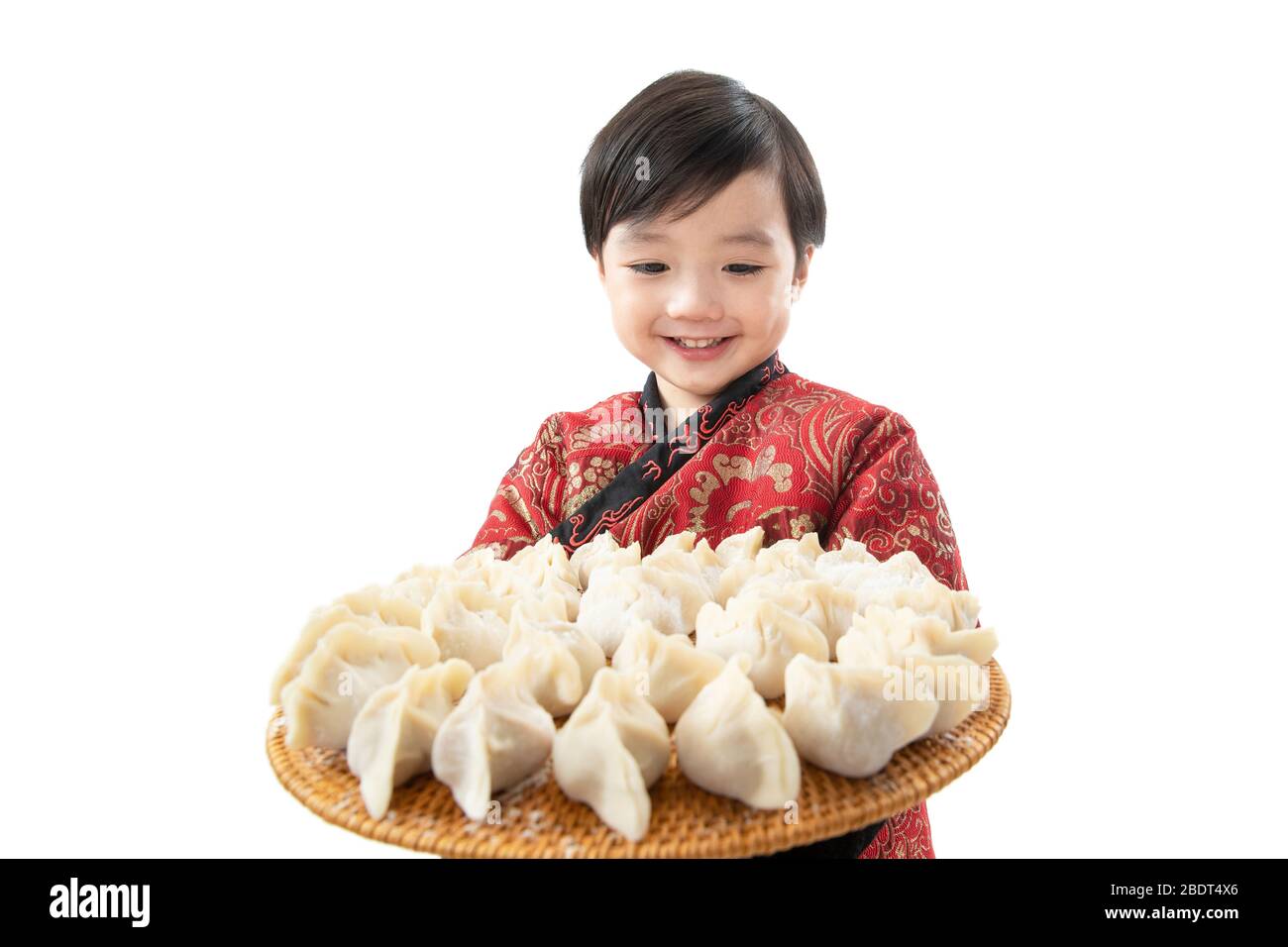 The little boy Chinese New Year pack dumpling Stock Photo - Alamy