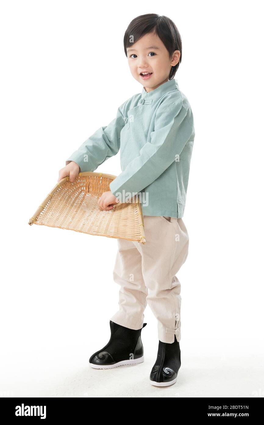 The little boy with a dustpan grain Stock Photo - Alamy