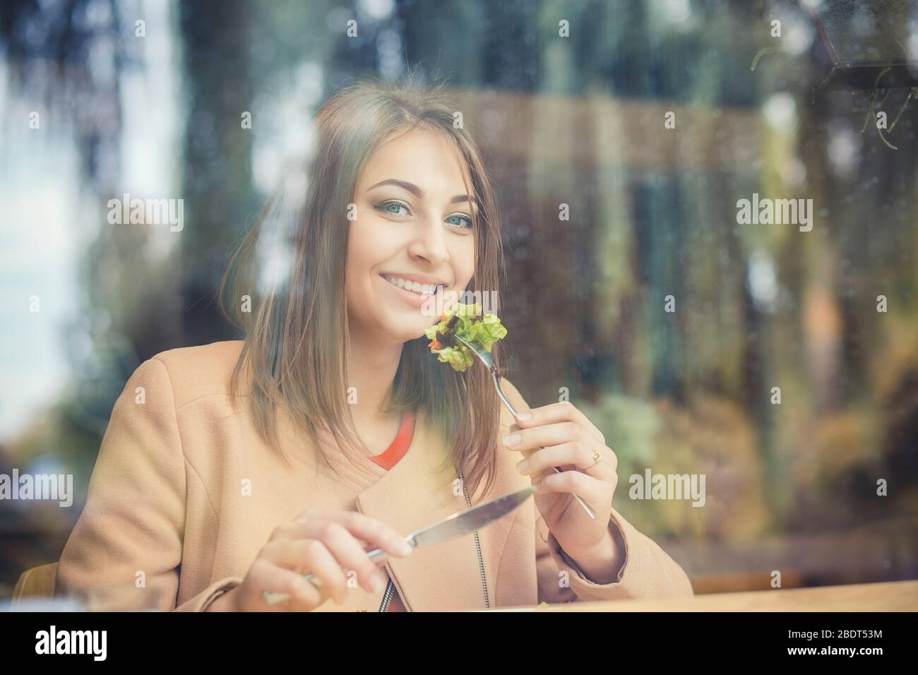 Woman happy eating. Closeup portrait beautiful smiling toothy girl ...