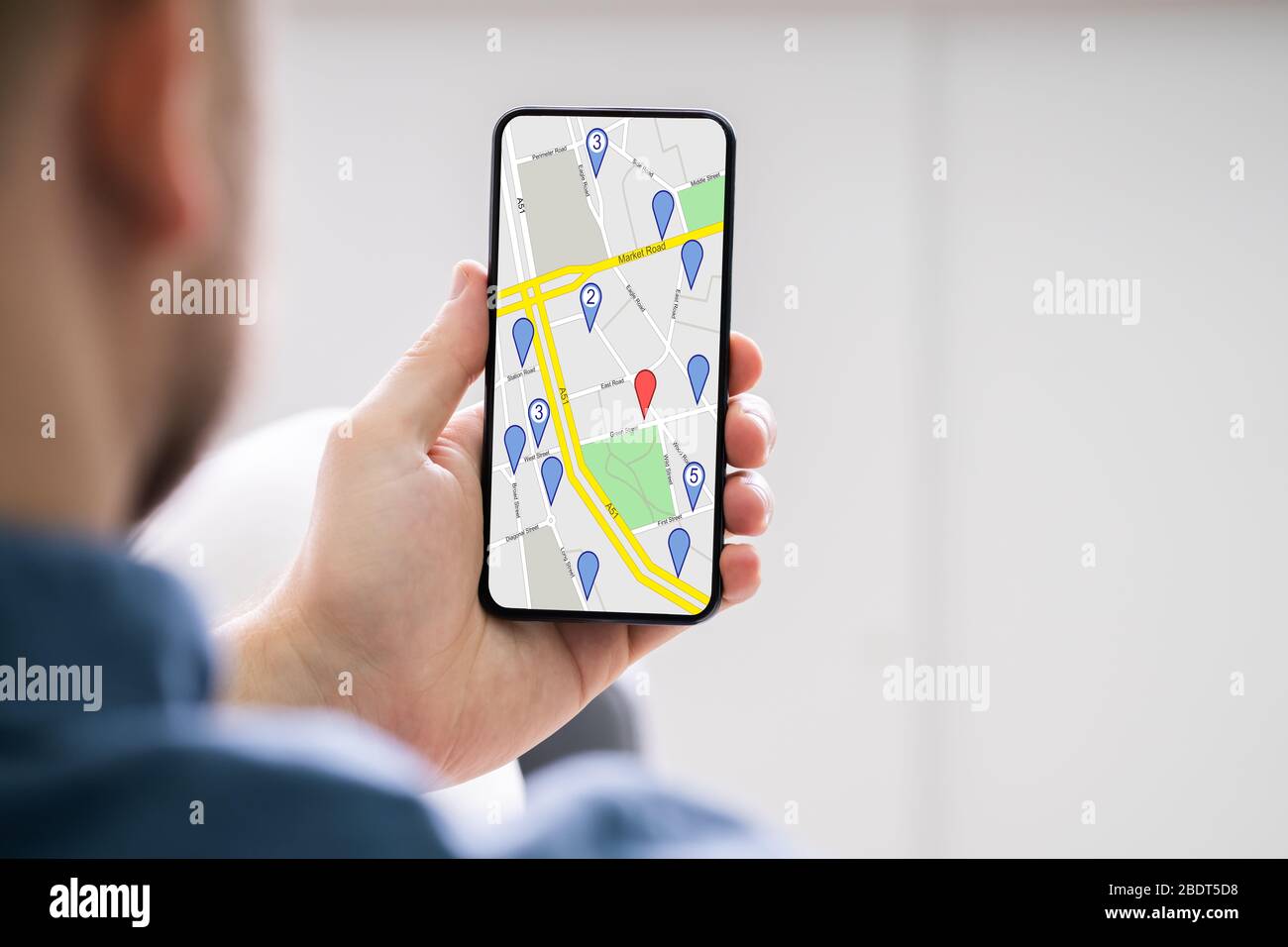 Close-up Of A Person's Hand Using GPS Navigation Map On Mobile Phone ...