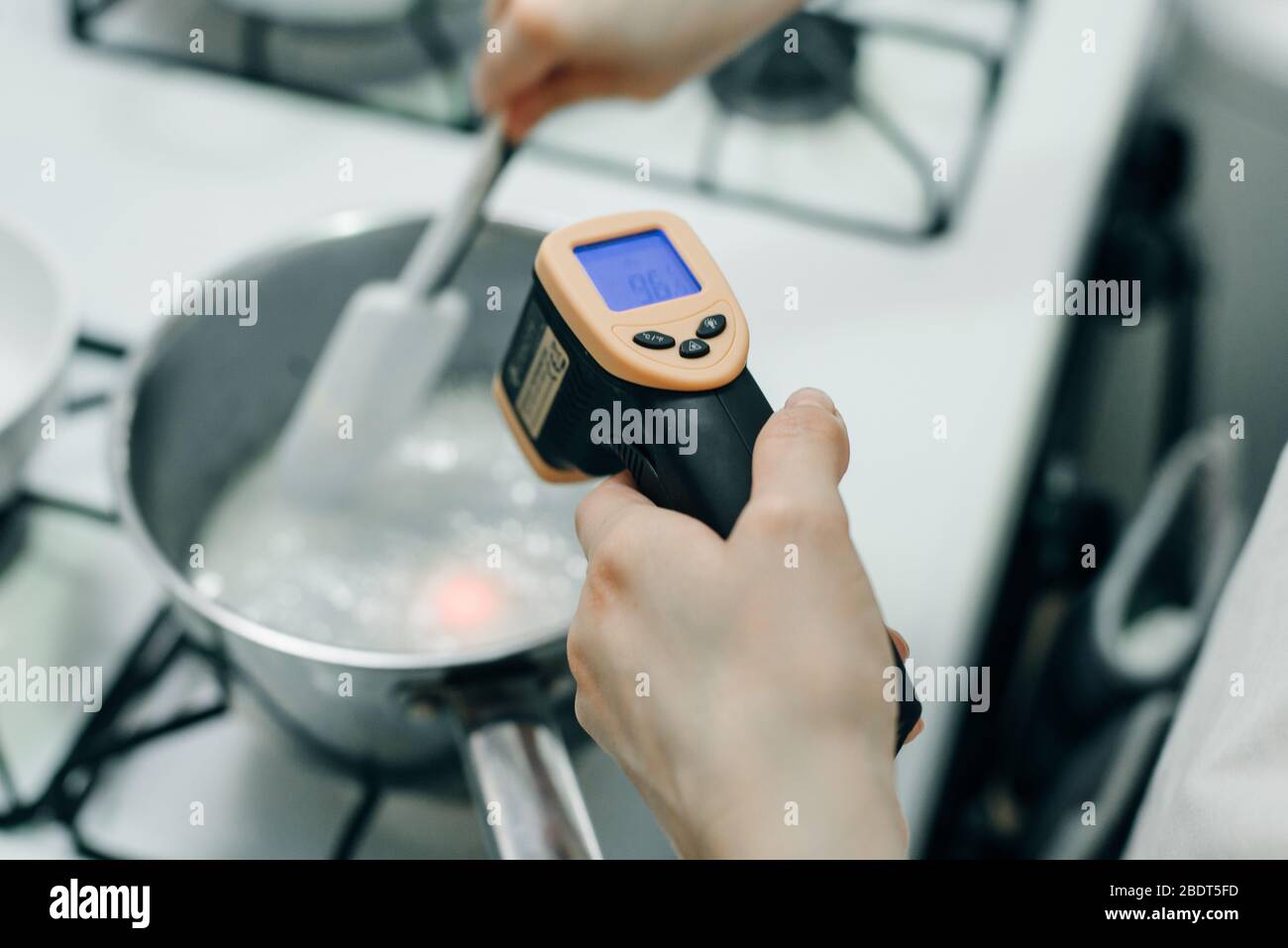 measuring the temperature of water by digital thermometer Stock Photo ...