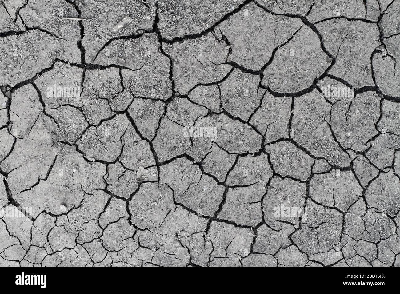 Cracked soil ground. Closeup Stock Photo - Alamy