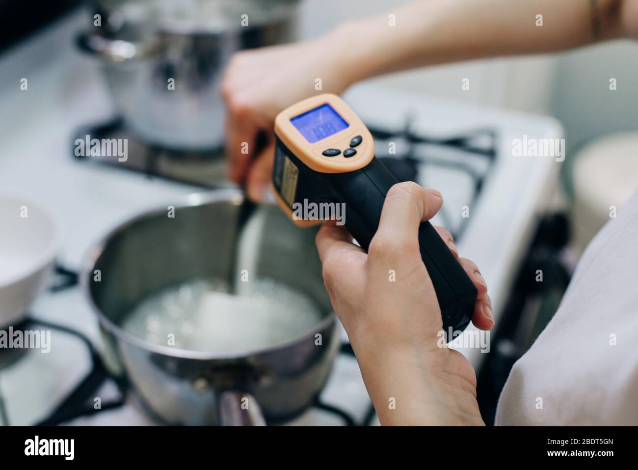 measuring the temperature of water by digital thermometer Stock Photo ...