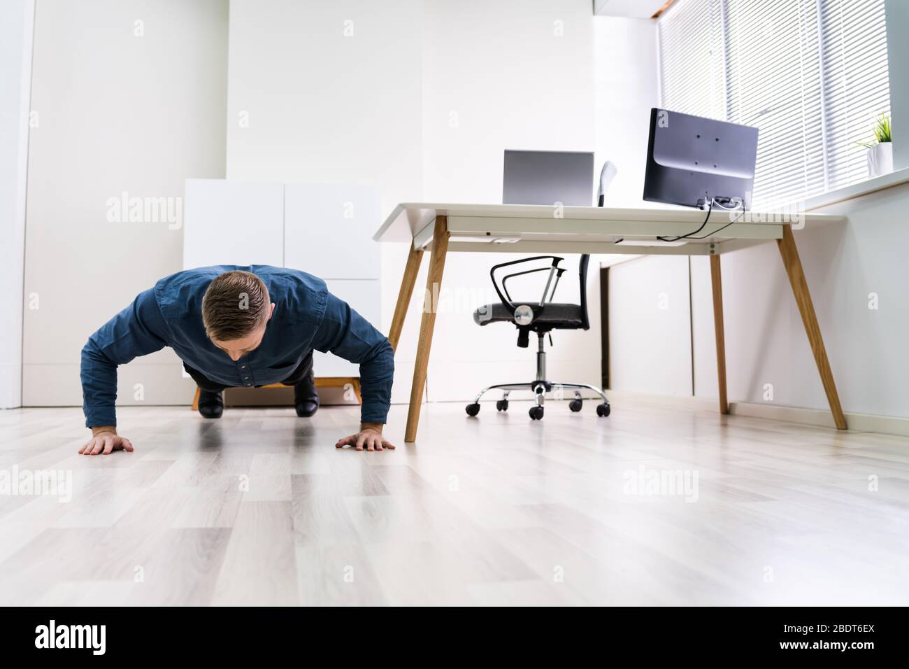 Man push ups chair hi-res stock photography and images - Alamy
