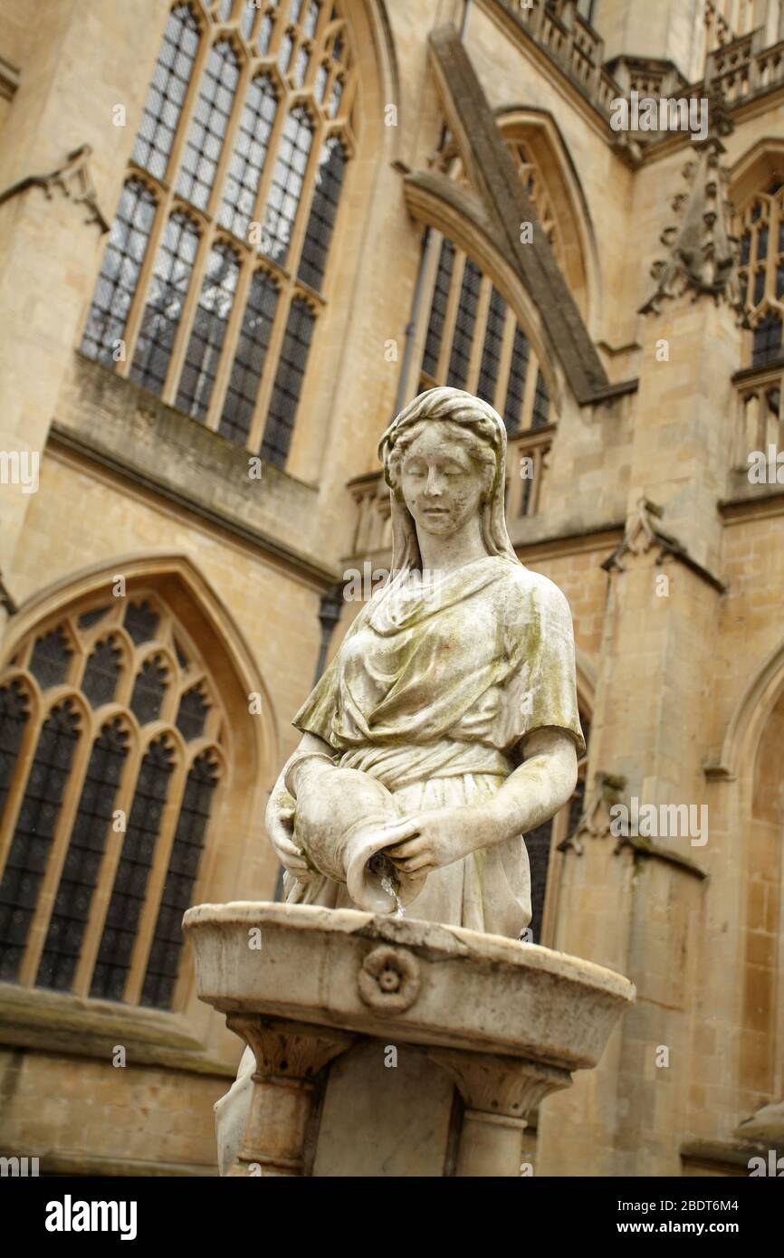 Statue of a woman pouring water outside Bath Abbey Stock Photo - Alamy