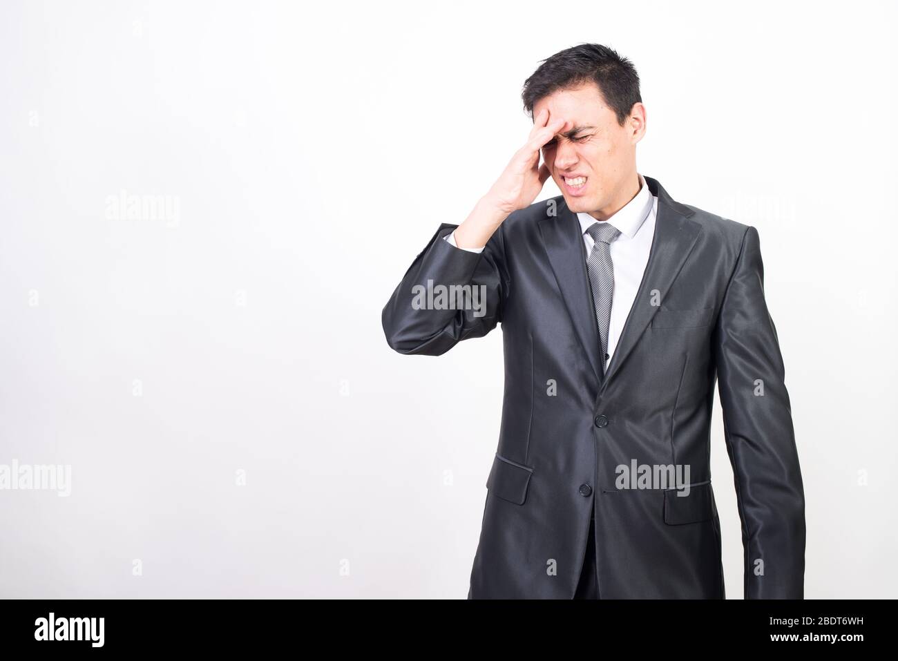 Sore man in suit. White background. middle plane Stock Photo - Alamy